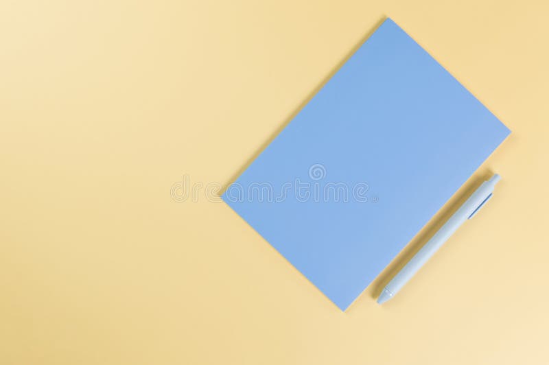 Top View of Blue Notebook, Blue Pen on Yellow Background. School ...