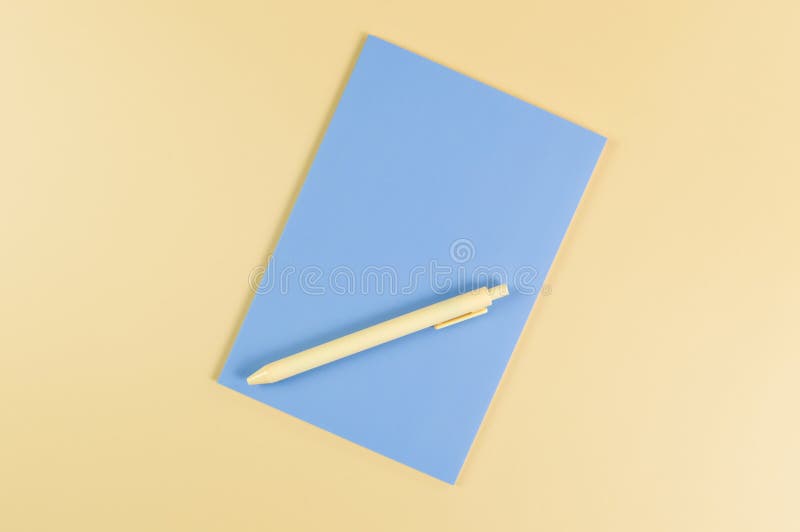 Top View of Blue Notebook, Yellow Pen on Yellow Background. School ...