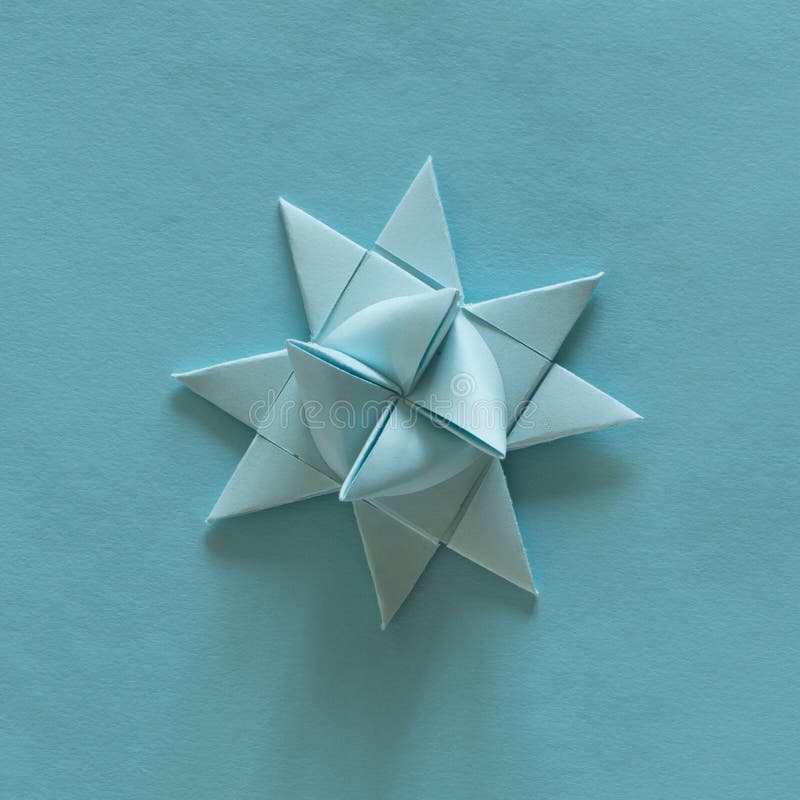 Top View of a Blue Origami 3D Star on Craft Paper on the Table Stock ...