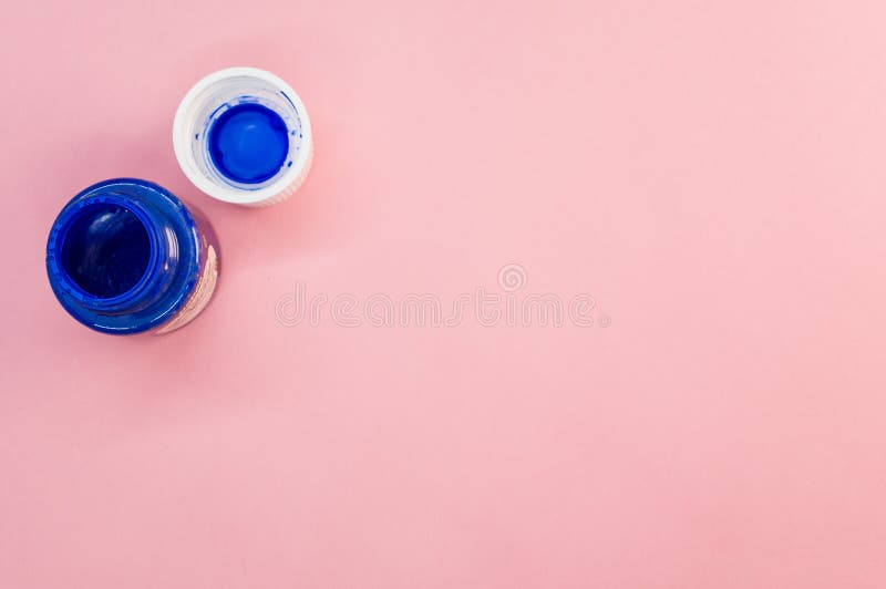 Top View of the Blue Paint in the Bottle with the Lid on the Pink ...