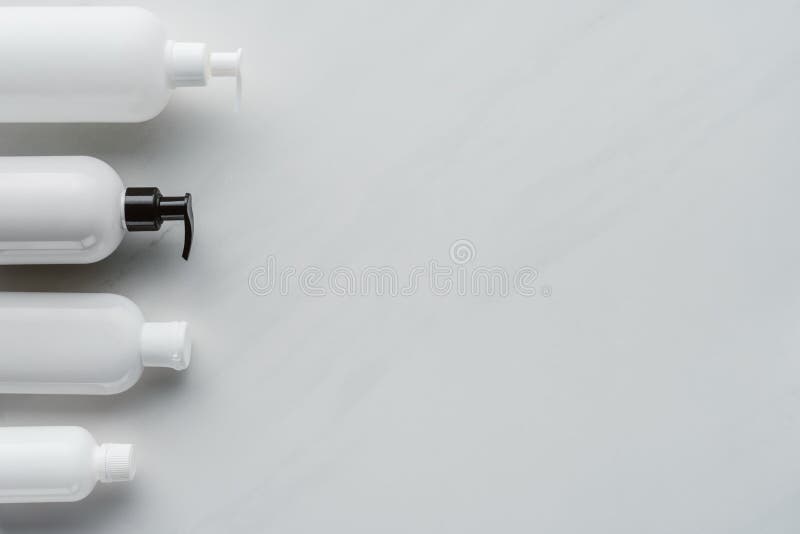 Top View of Bottles of Lotion on White Surface Stock Image - Image of ...