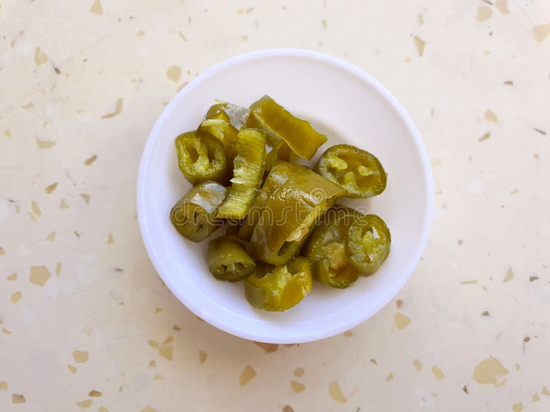 Pickled green chilies stock image. Image of vinegar - 265250269