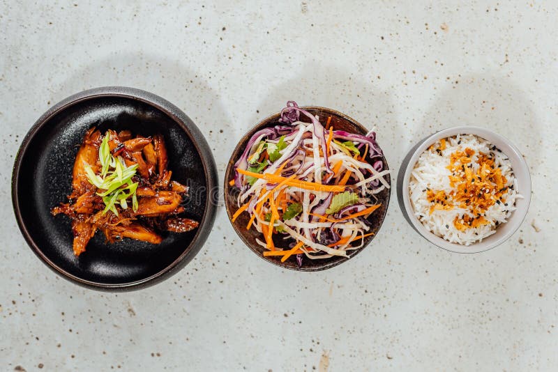 Top View of a Bowl of Vegetables, White Rice, and Meat on a White Table ...