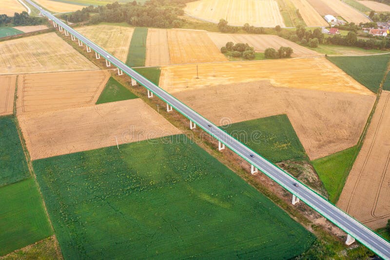 Top View of Bridge Road Over Green Fields Editorial Stock Photo - Image ...