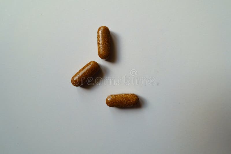 Top View of 3 Brown Caplets of Iron Dietary Supplement Stock Image ...