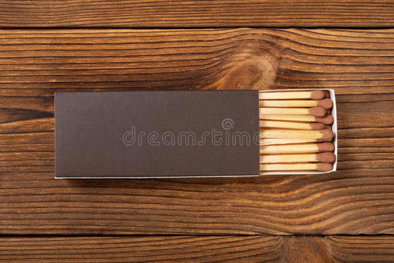 Brown Color Matchbox with Brown Match Sticks on a Wood Table Stock ...