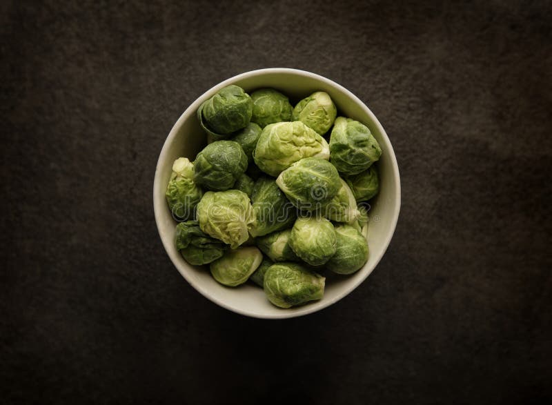 Top View of Brussels Sprouts in a White Bowl on a Wooden Table Stock ...