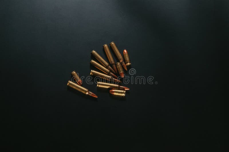 Top View of Bullets on a Black Surface Stock Photo - Image of wallpaper ...