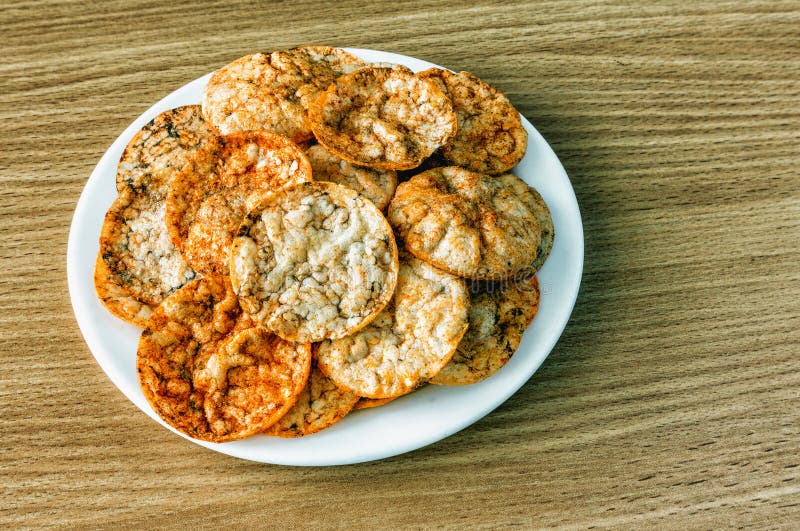 Brown Rice Chips in a Plate on a Table Surface Stock Photo - Image of ...