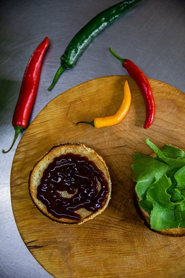 Top View of a Burger Bread with BBQ Sauce on it on a Wooden Board - the ...