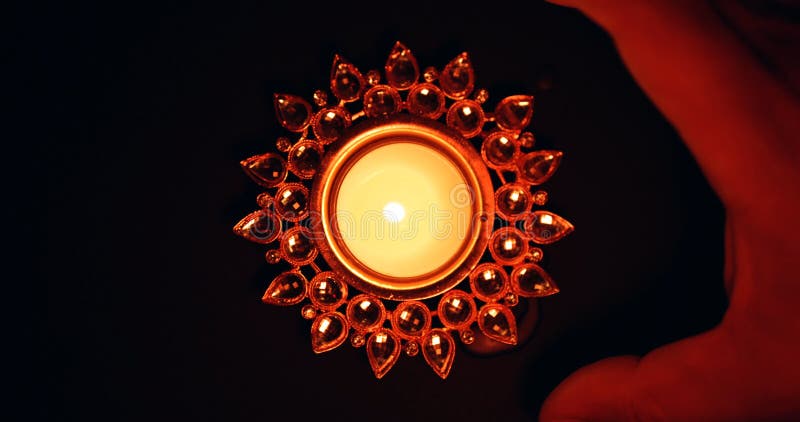 Top View of a Burning Candle in a Beautiful Sun-shaped Candlestick Base ...