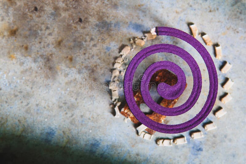 Top View Burning Mosquito Coil with Ashes Drop on a Galvanized Floor ...