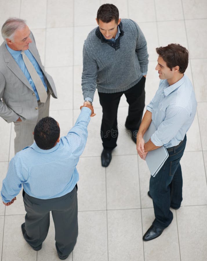 Top View of a Business Men Handshaking at Work Stock Image - Image of ...