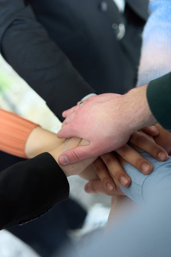 A Top View of Business People Joining Hands in a Circle, Symbolizing ...