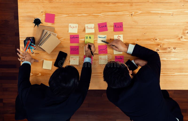 Business Team Gather on Table, Brainstorming and Writing Creative Idea ...
