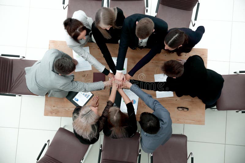 Top View. Business Team Making a Stack of Hands Over the Desktop Stock ...