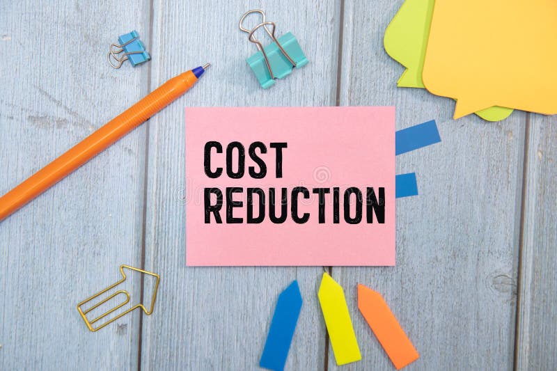 Top View Calculator,banknotes and Brown Card with Text COST REDUCTION ...