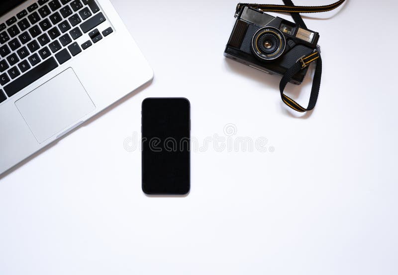 Top View of a Camera, Smartphone and a Laptop on a White Table Stock ...