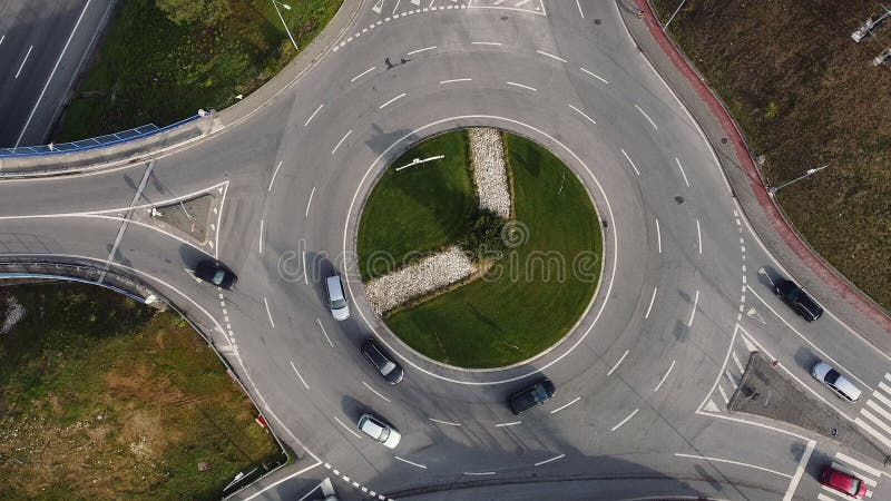 Top View of Cars Driving on a Roundabout Road Stock Video - Video of ...