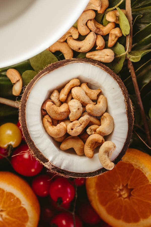 Top View of Cashew Nuts Inside a Coconut Shell with Assorted Fruits ...