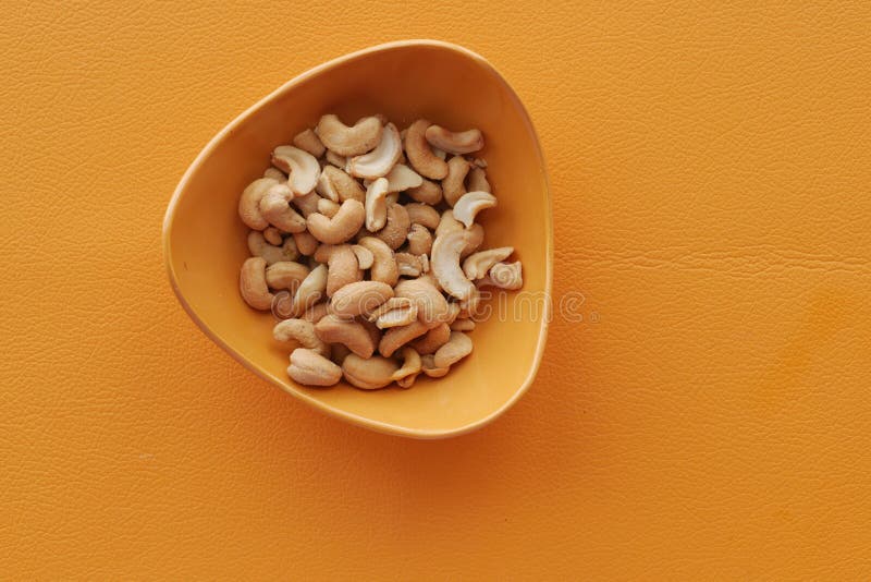 Top View of Cashew Nuts in a Orange Color Bowl Stock Image - Image of ...