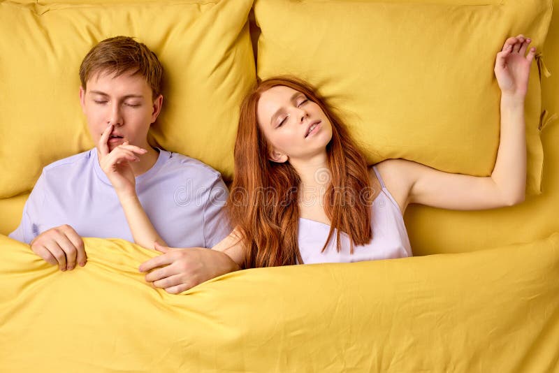 Top View On Caucasian Couple Lying On Bed Woman Disturbing Man To