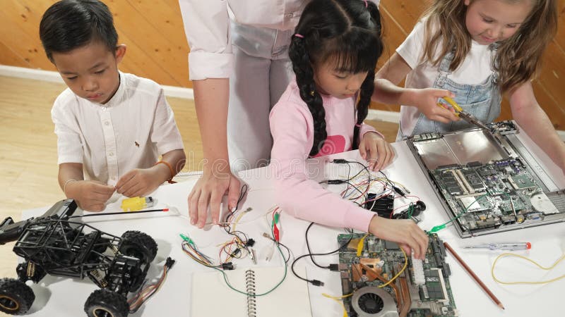 Young Smart Teacher Teaching Diverse Students about Electronic Board ...