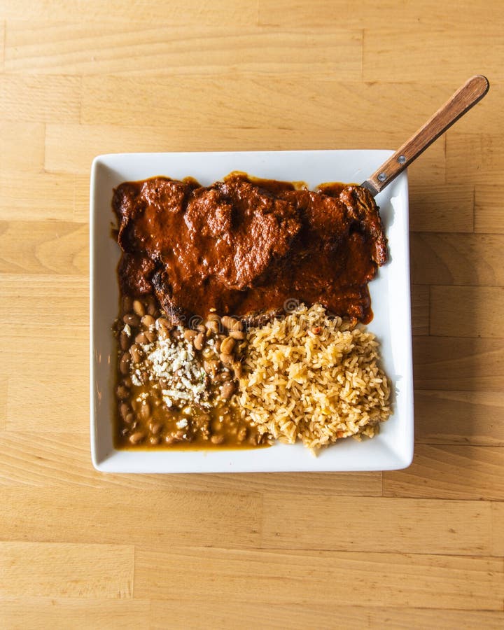 Top View of Charro Beans and Rice with a Side of Mole on a Wooden ...