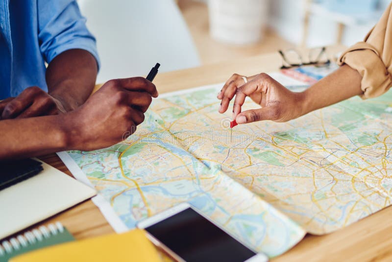 Top View of Checking Directions for Location Using Cartography on ...