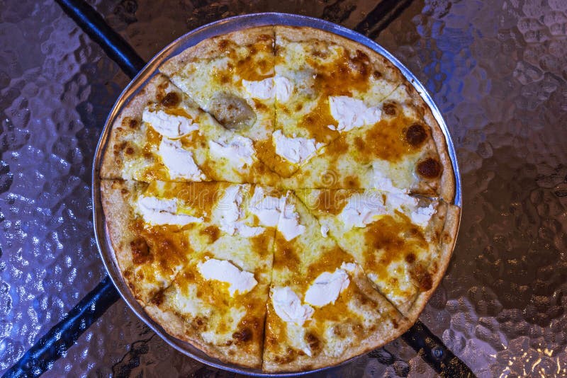 Top View of a Cheese Pizza with Dollops of Ricotta on Glass Table ...