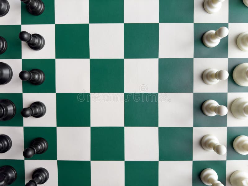Top View of Chess Pieces on a Green and White Checkered Board Stock ...