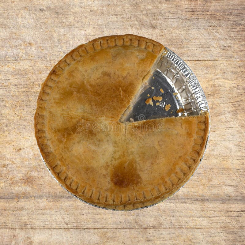 Top View of a Chicken Meat Pie with One Slice Missing on a Wood Cutting ...