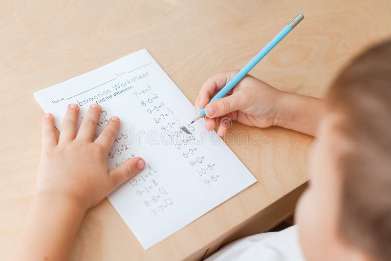Top View of Child Hands with Pencils. Solving Maths Exercises Stock ...