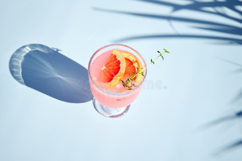 Top View of Chilled Cocktail with Grapefruit and Thyme Sprig. Cold ...