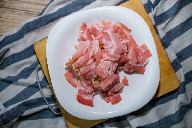 Top View Chopped Chopped Bacon Lying on a Plate in the Kitchen, Indoors ...