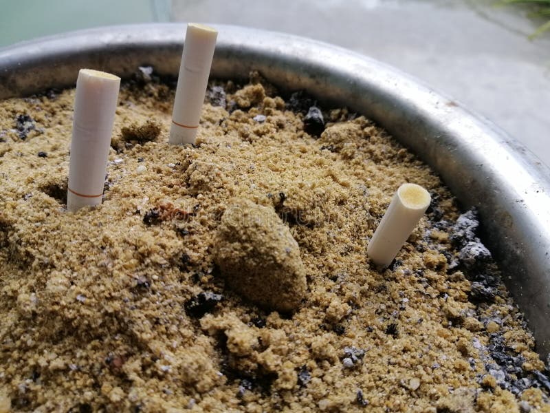 Top View Cigarettes Butts Drip on Standy Sand Smoking Area. Stock Image ...