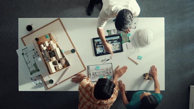 Top View of Engineer Looking Tablet and Planning Building Design ...