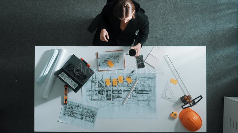 Top View Civil Engineer Writing Sticky Note and Looking at Laptop ...