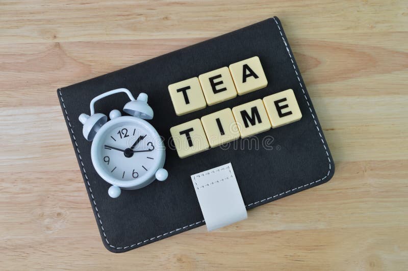 Notebook, Clock and Square Letters with Text TEA TIME Stock Image ...