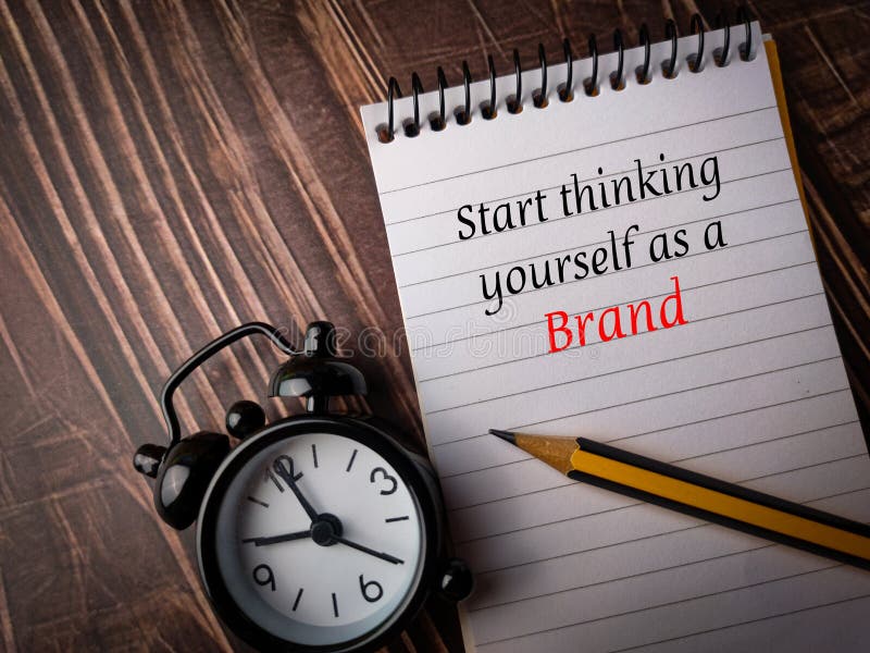 Top View Clock and Pencil with Text Start Thinking Yourself As a Brand ...
