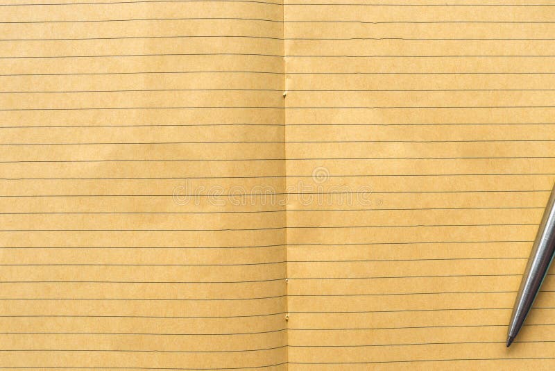 Top View Closed Up of Yellow Notebook with Line Texture and Pen Stock ...