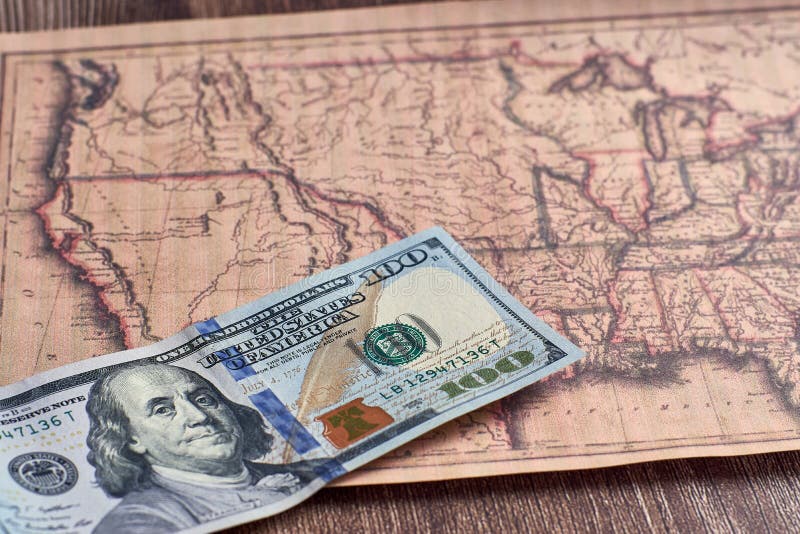 Top View Closeup of 100$ Banknote Placed on an Ancient Map on a Wooden ...