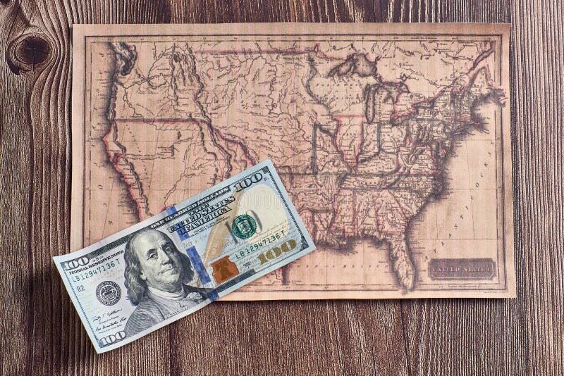 Top View Closeup of 100$ Banknote Placed on an Ancient Map on a Wooden ...