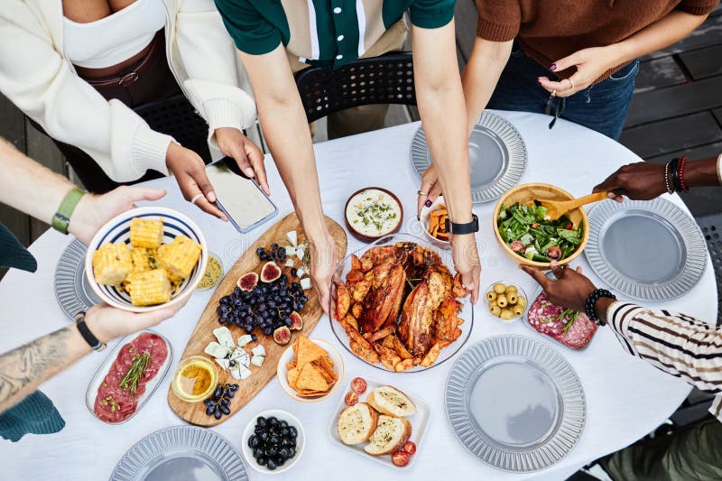 Hands Serving Dishes stock photo. Image of outdoors - 341721336