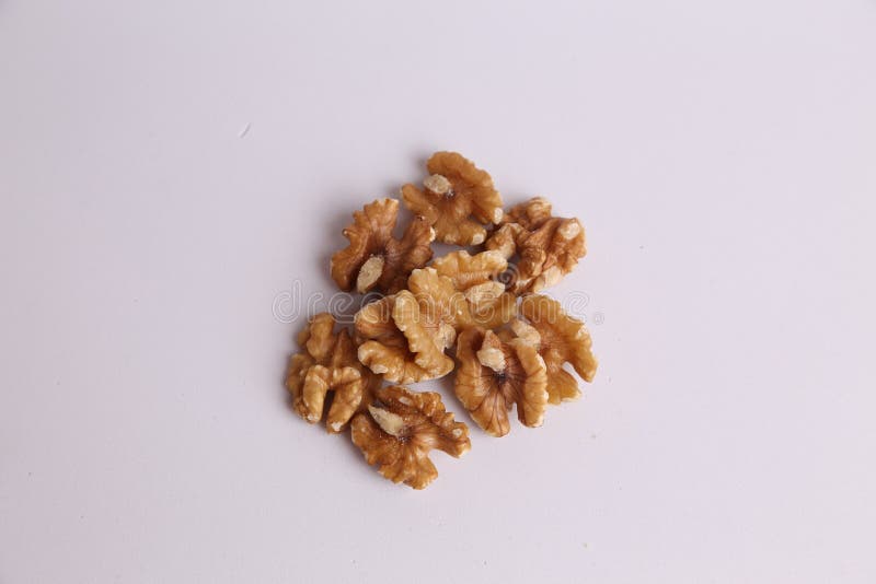 Top View Closeup of a Pile of Walnut Kernels on a White Surface Stock ...