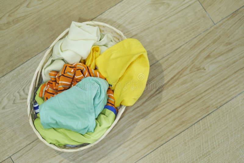 Top View Clothes in a Laundry Basket on Wood Floor. Stock Image - Image ...
