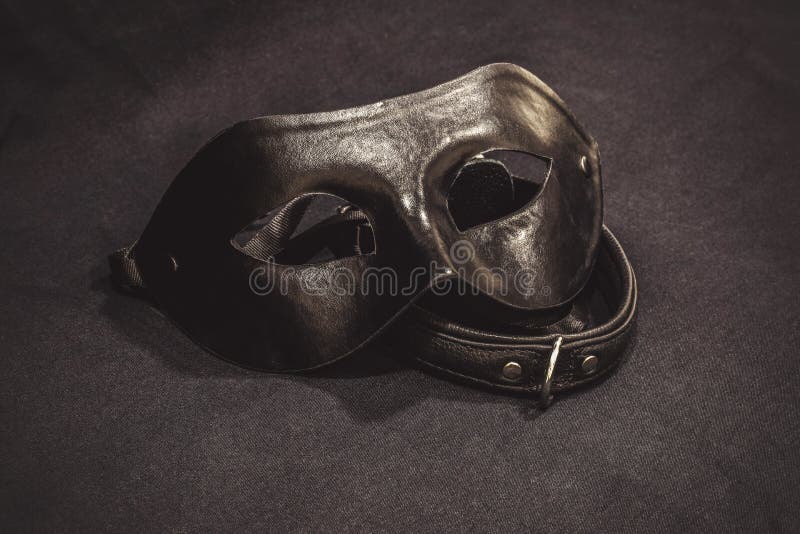 Top View of Collar and Black Mask on Black Textile Background Stock ...