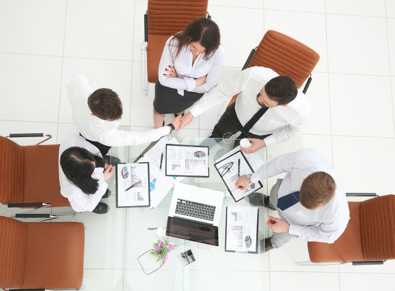 Top View.colleagues Shaking Hands before a Working Meeting at the ...