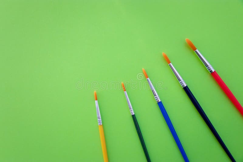 Top View Colored Brushes Isolated on Green Background. Concept of Art ...