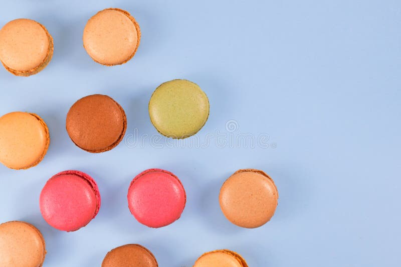 Top View of Colorful French Macaron Sweets on Side of Blue Background ...